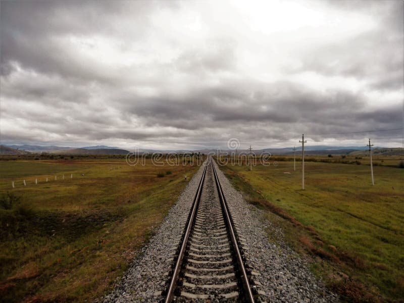 Single railroad track stock photo. Image of cloudy, grass - 66726964