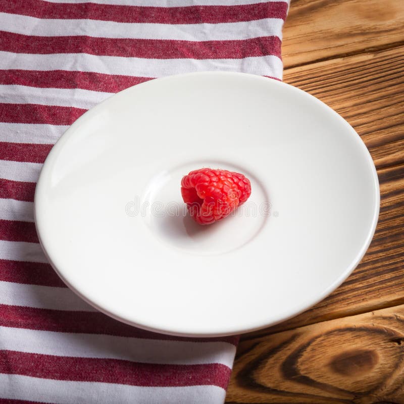 A Single Raspberry on a White Dish Stock Image - Image of ripe, dessert ...
