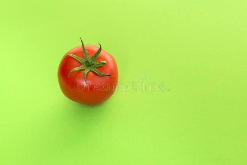 Single Real Tomato Seen at Its Top on a Green Background Stock Image ...