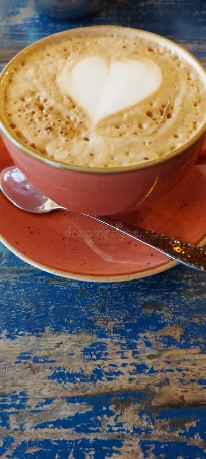Single Red Cup and Saucer with Frothy Cappuccino. Stock Image - Image ...