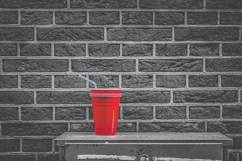 Single Red Cup with a Straw Near a Black Wall Stock Photo - Image of ...