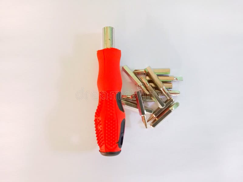 A Single Red-orange Screwdriver Handle with Black Grip, Accompanied by ...