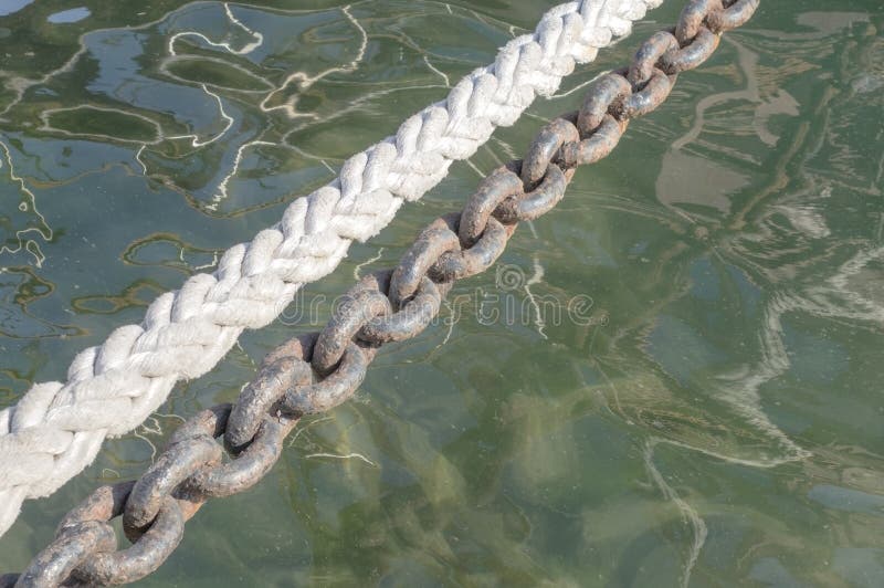 Single Rope Line and Anchor Chain Stock Image - Image of attached ...