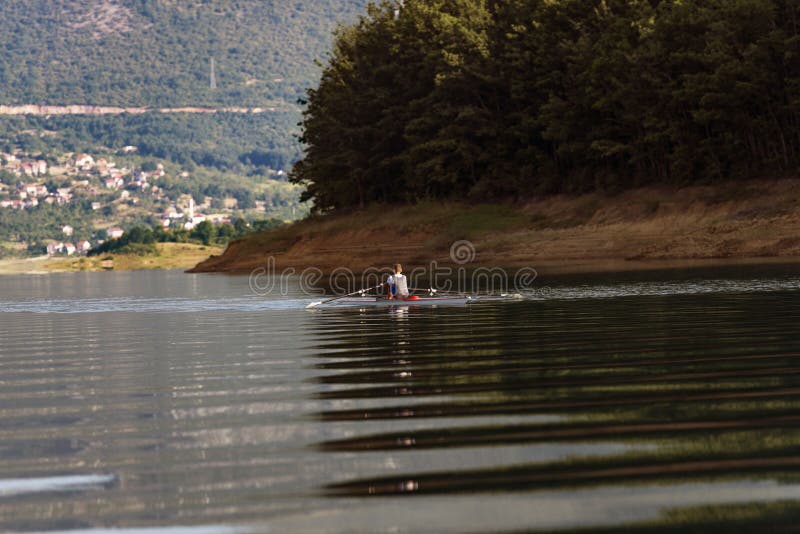Single rower at sunrise stock image. Image of dawn, motivate - 86080773