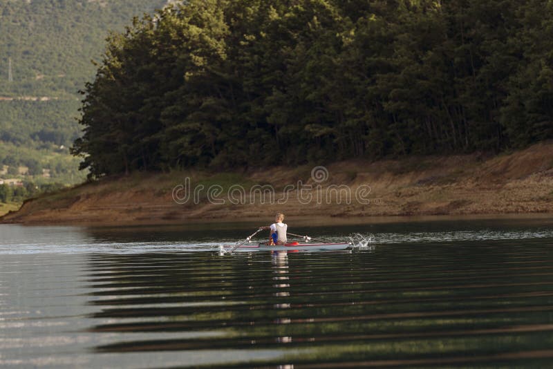 Single rower at sunrise stock photo. Image of dawn, boat - 86099098
