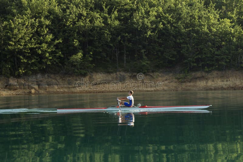 Single rower at sunrise stock image. Image of lifestyle - 7060693