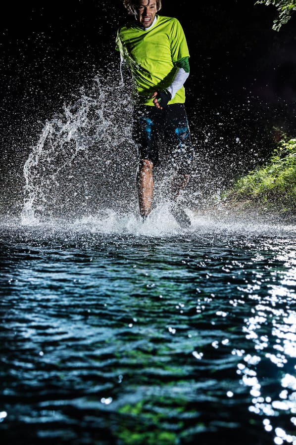 Single Runner Running, Making Splash in a Stream. Stock Image - Image ...