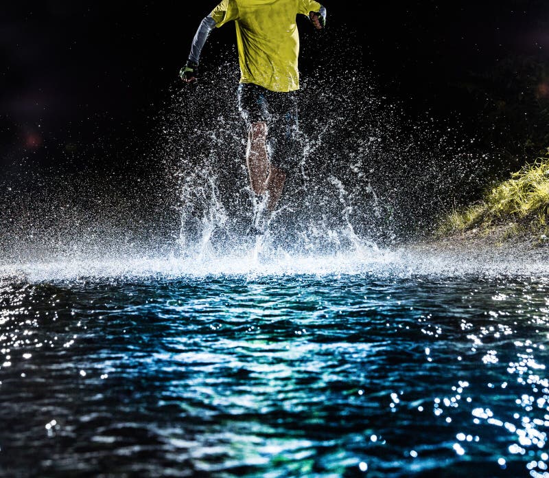 Single Runner Running in Rain and Making Splash in Puddle Stock Image ...