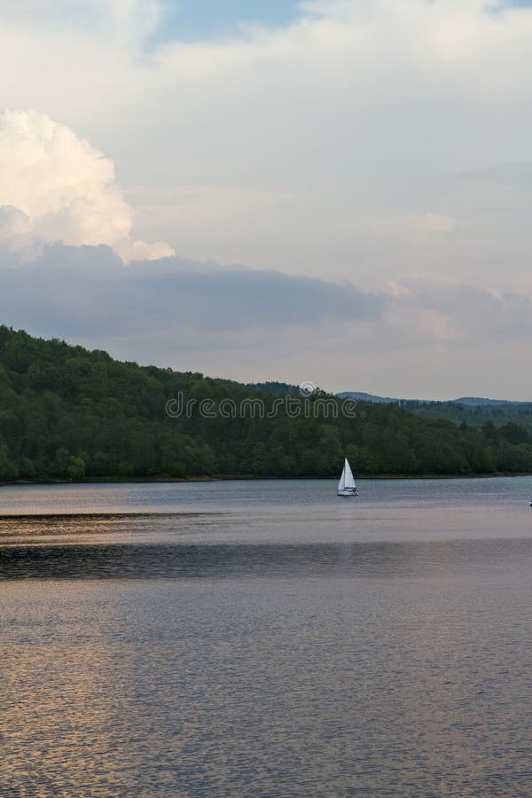 Single Sailboat in the Lake at the Sunset Stock Photo - Image of clalm ...
