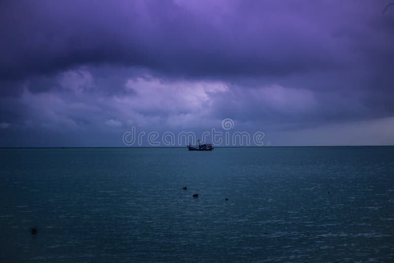 Single Ship on the Calm Sea Under the Clouds in the Evening Stock Image ...