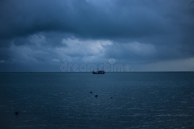 Single Ship on the Calm Sea Under the Clouds in the Evening Stock Photo ...