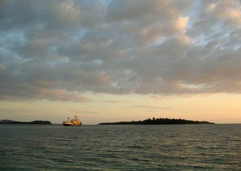 Single Ship in the Middle of the Sea Under the Cloudy Sky Stock Image ...