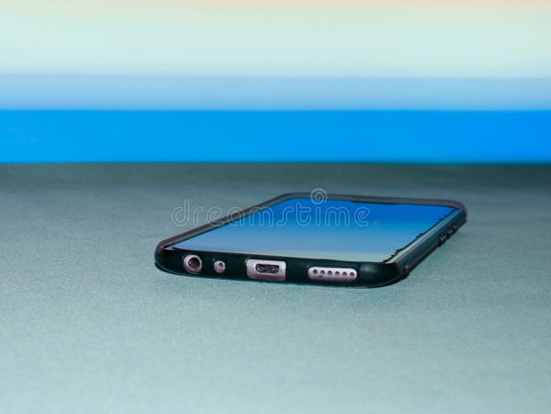 Smart Phone Presented on Blueish Rays Light Effect Background Stock ...