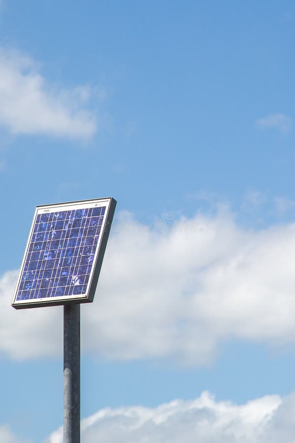 A Single Solar Panel with a Blue Sky and White Clouds in the Background ...