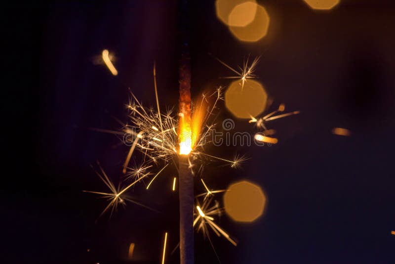 Sparkler with Hot Glowing Embers in Front of US American Flag for 4th ...