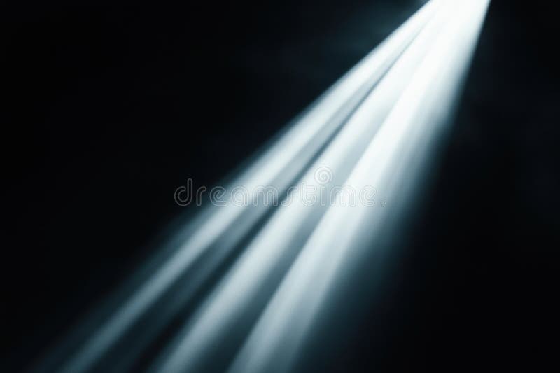 A Single Spotlight Beam Casting Across a Dark Background Stock ...