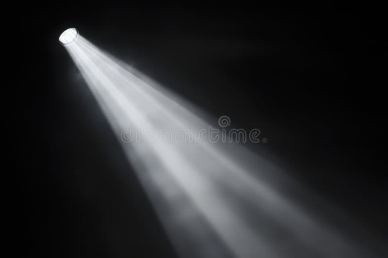 A Single Spotlight Illuminates a Dark Room with a Bright Beam of Light ...
