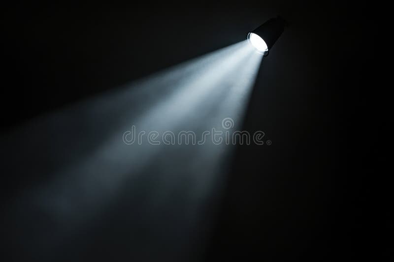 A Single Spotlight Illuminating a Dark Room with a Beam of Light Stock ...