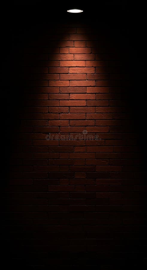 Single Spotlight Illuminating a Textured Red Brick Wall Against a Dark ...