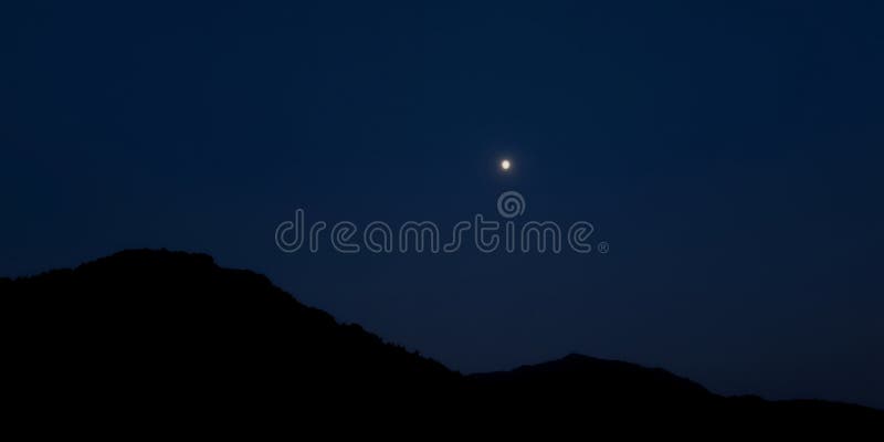 A Single Star Shines Brightly in the Dark Night Sky Illuminating the ...