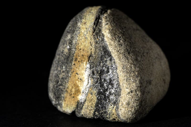 Single Stone with Red and Brown Geological Pattern Isolated on Black ...