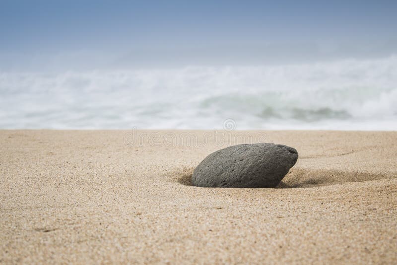 Single stone in sand stock image. Image of space, closeup - 110829365