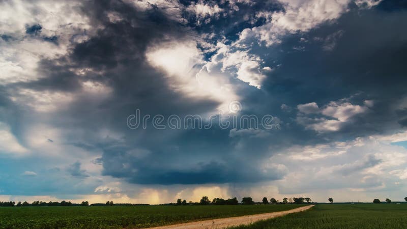 Single Storm Cell Cloud with Sun Rays Forming Over the Fields Stock ...