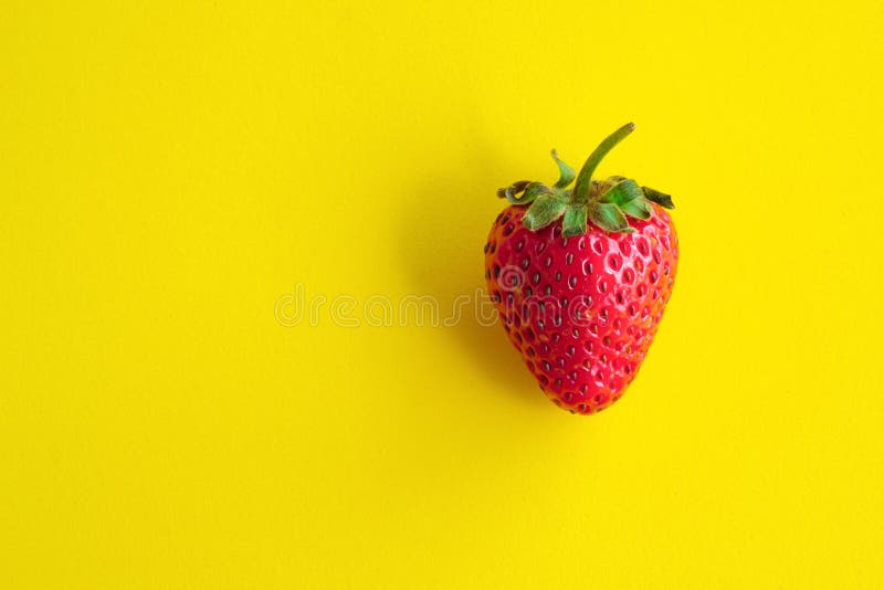 Single Strawberry on a Yellow Background Stock Image - Image of ...
