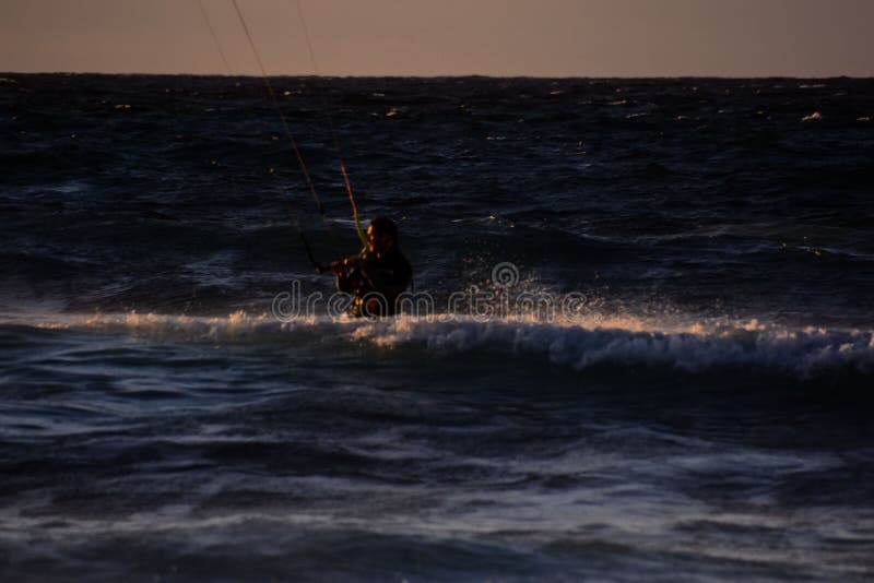 Surfer at Sunset on a Calm Ocean Stock Image - Image of adventure ...