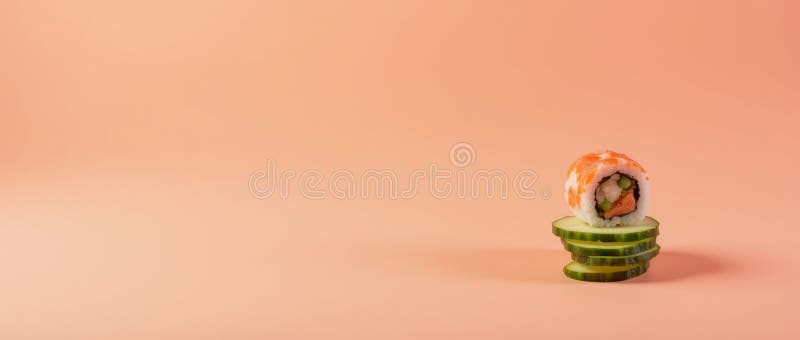 Single Sushi Roll on a Raised Platform of Sliced Cucumber Placed on a ...
