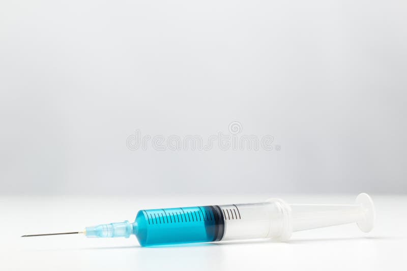 Single syringe in white stock photo. Image of treatment - 82313336