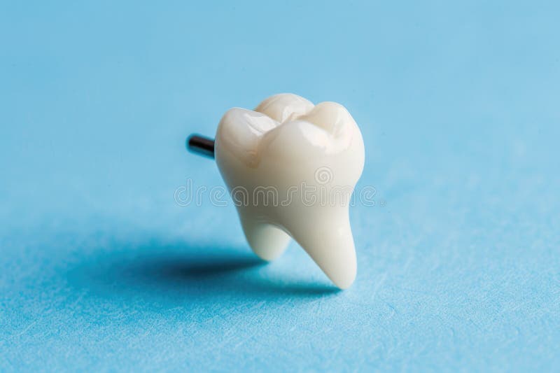 A Single Tooth on a Blue Surface. Suitable for Dental or Health ...