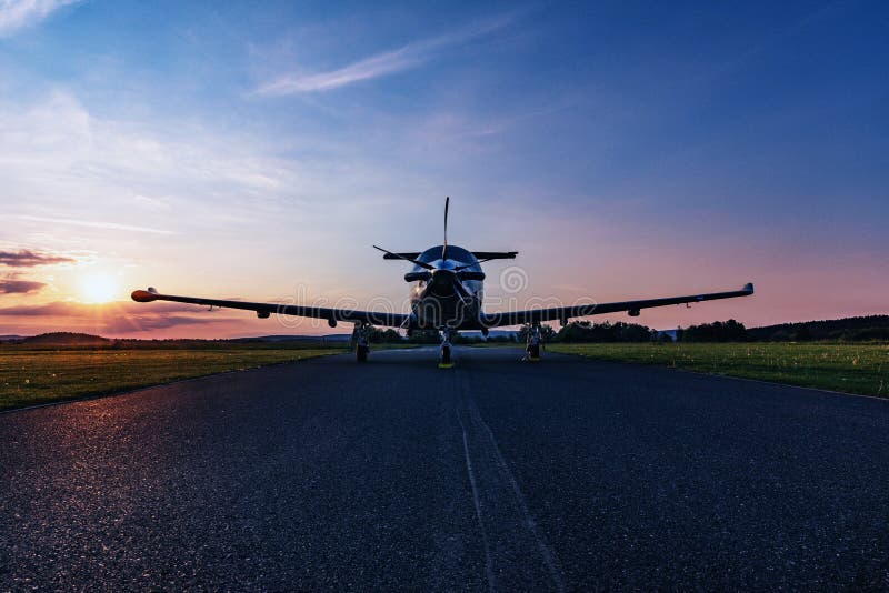 Single Turboprop Aircraft on Evening Runway. Stock Image - Image of ...