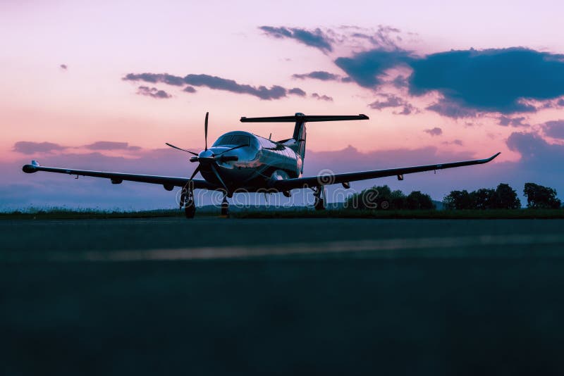 Single Turboprop Aircraft on Evening Runway. Stock Image - Image of ...