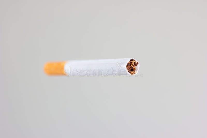 Single Unlit Cigarette Stick with Yellow Filter Studio Close Up Shot ... Single Unlit Cigarette Stick with Yellow Filter Studio Close Up Shot ...
