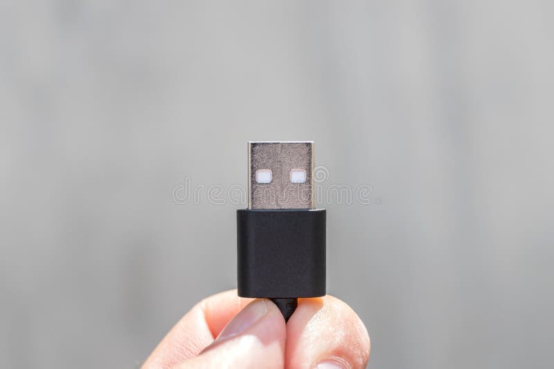 Single usb cable in hand stock image. Image of universal - 152780967
