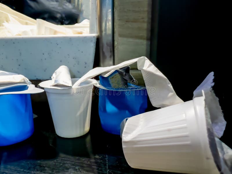 Single Use Coffee Creamer Cups As Trash on Counterspace Stock Photo ...