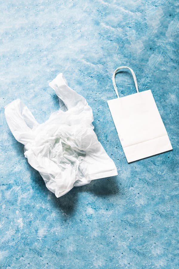 Single Use Plastic Bag Next To Paper One, Plastic Pollution and ...