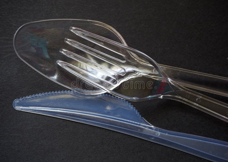 Single-use Plastic Cutlery on a Black Stock Image - Image of pollution ...