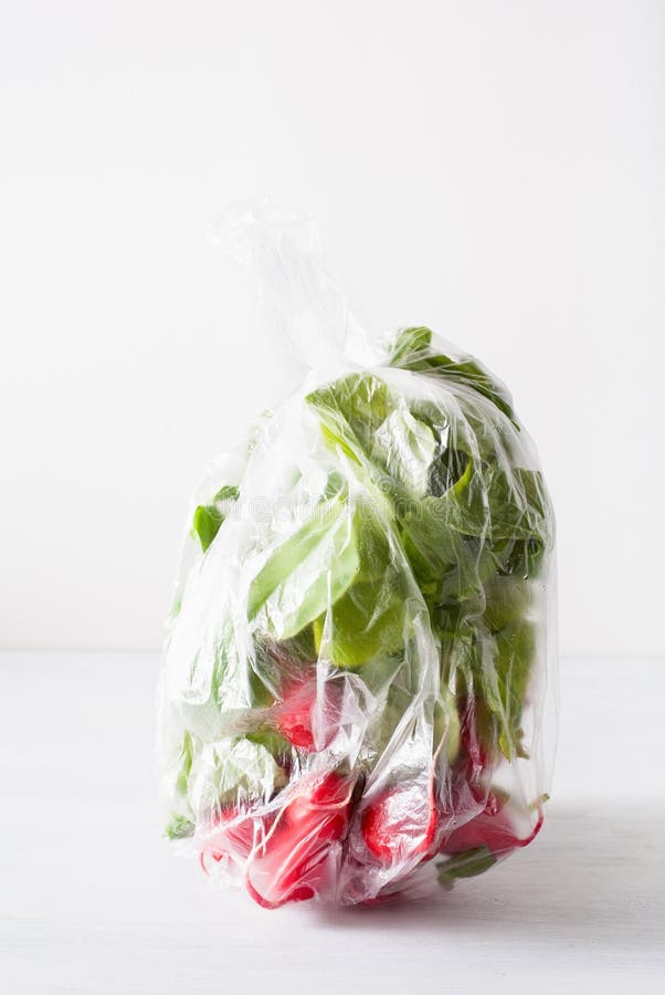 Single Use Plastic Packaging Issue. Radish Vegetable in Plastic Bag ...