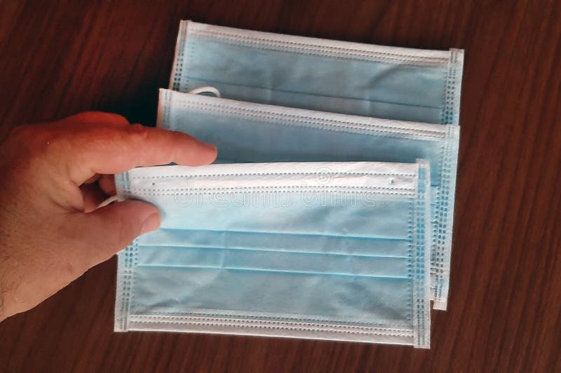 Single-use Surgical Mask Pack 3 and Hand Stock Image - Image of ...