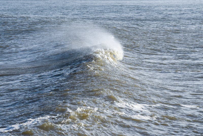 A Single Wave Breaks with White Water in the Ocean Stock Photo - Image ...