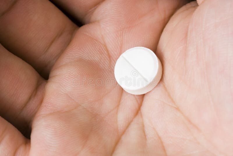 Single white pill in palm stock photo. Image of treatment - 2899982