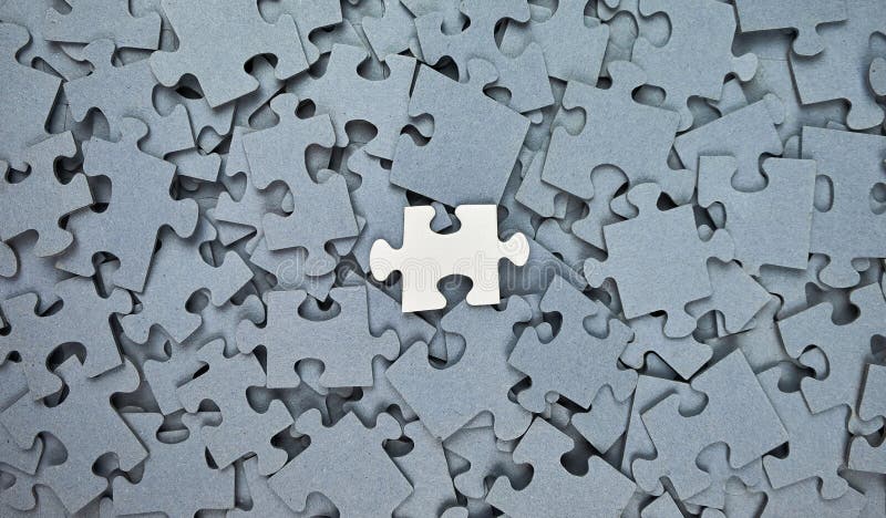 Single White Puzzle Piece Standing Out among Many Colorless Pieces ...