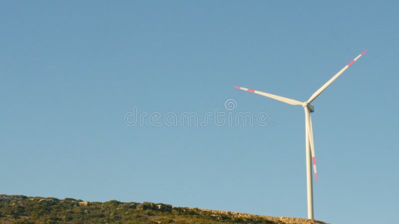 Single Wind Turbine Spins Around Generating Energy in the Blue Sky ...