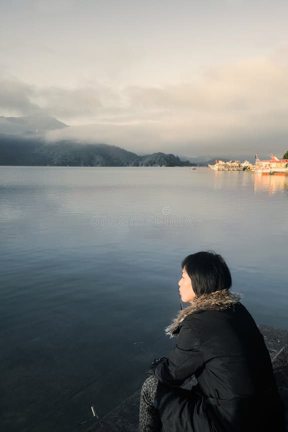 Single Woman Sitting and Waiting Stock Photo - Image of outdoor, cloud ...