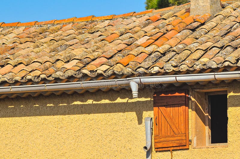 Single Wood, Shutter, Open and a Damages Rain Gutter Downspout Stock ...