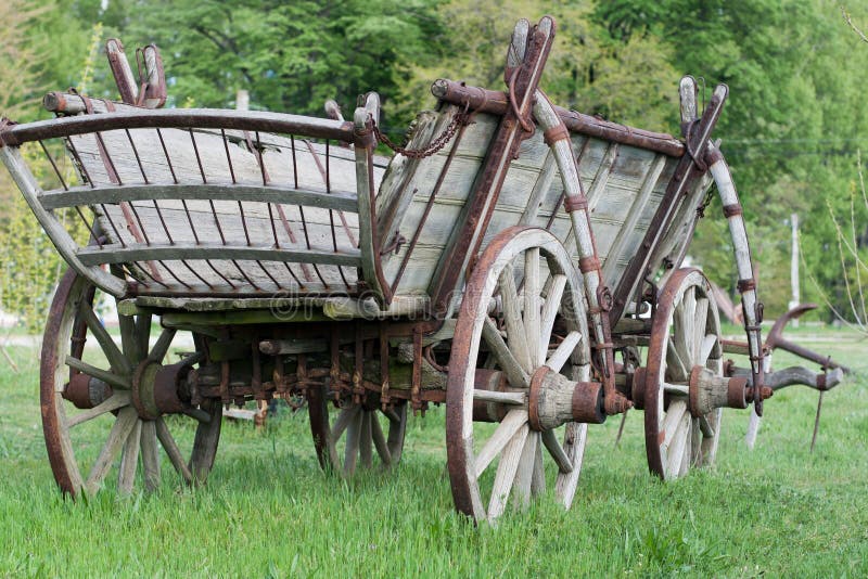 Single Wooden Cart on a Green Field. Stock Image - Image of field ...