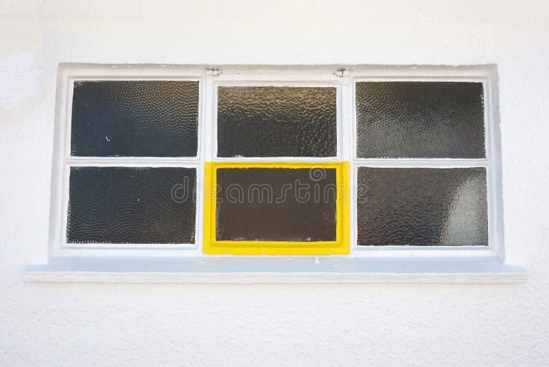 Single Yellow Window with Others in White Stock Photo - Image of ...