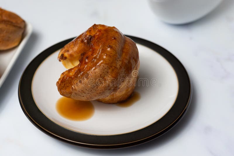 Single Yorkshire Pudding Covered in Gravy Side View Stock Photo - Image ...